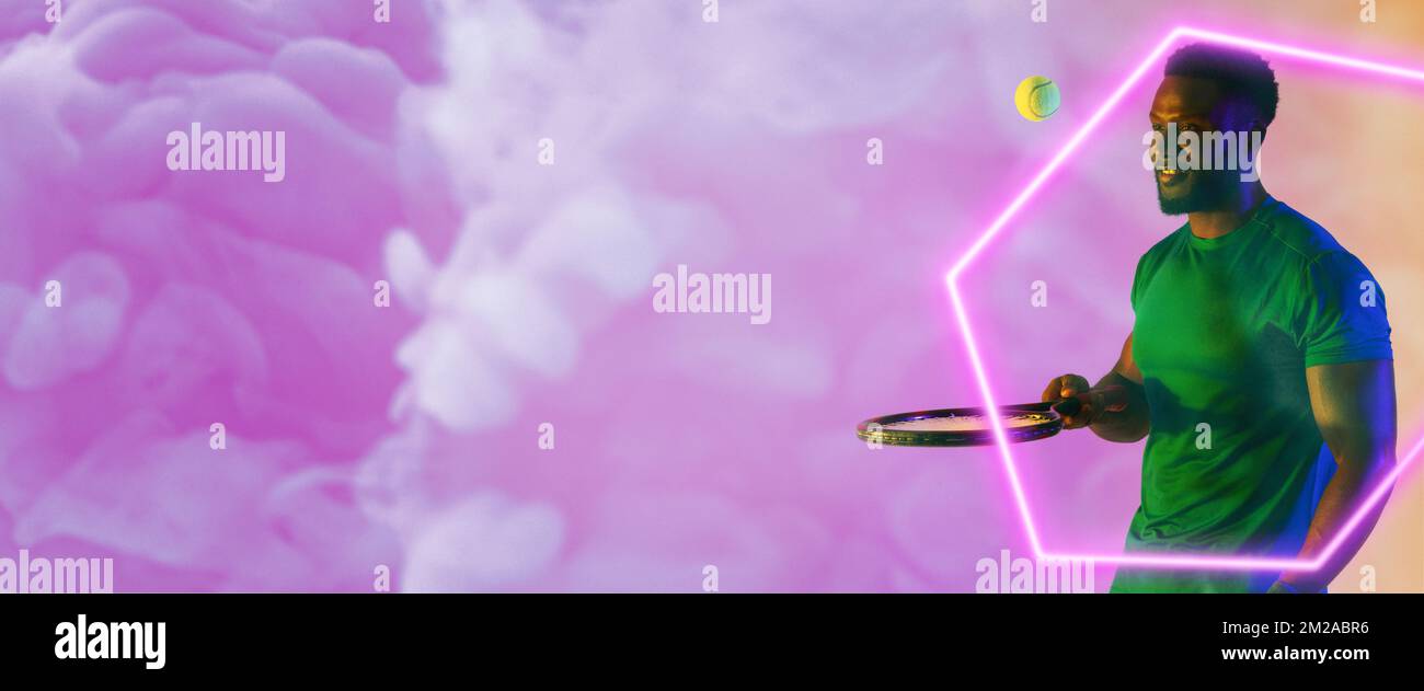 Illuminated triangle over african american male player with ball and ...