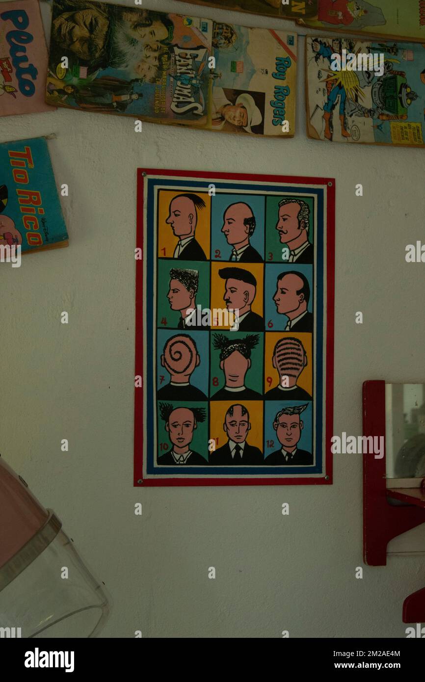 Close Up to an old hairstyle cuts sign with vintage comic books Stock ...