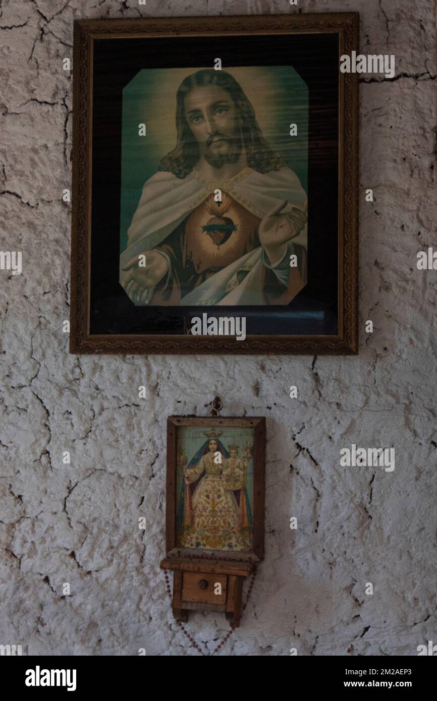 Close up to an antique jesus christ paint with a small holy mary ...