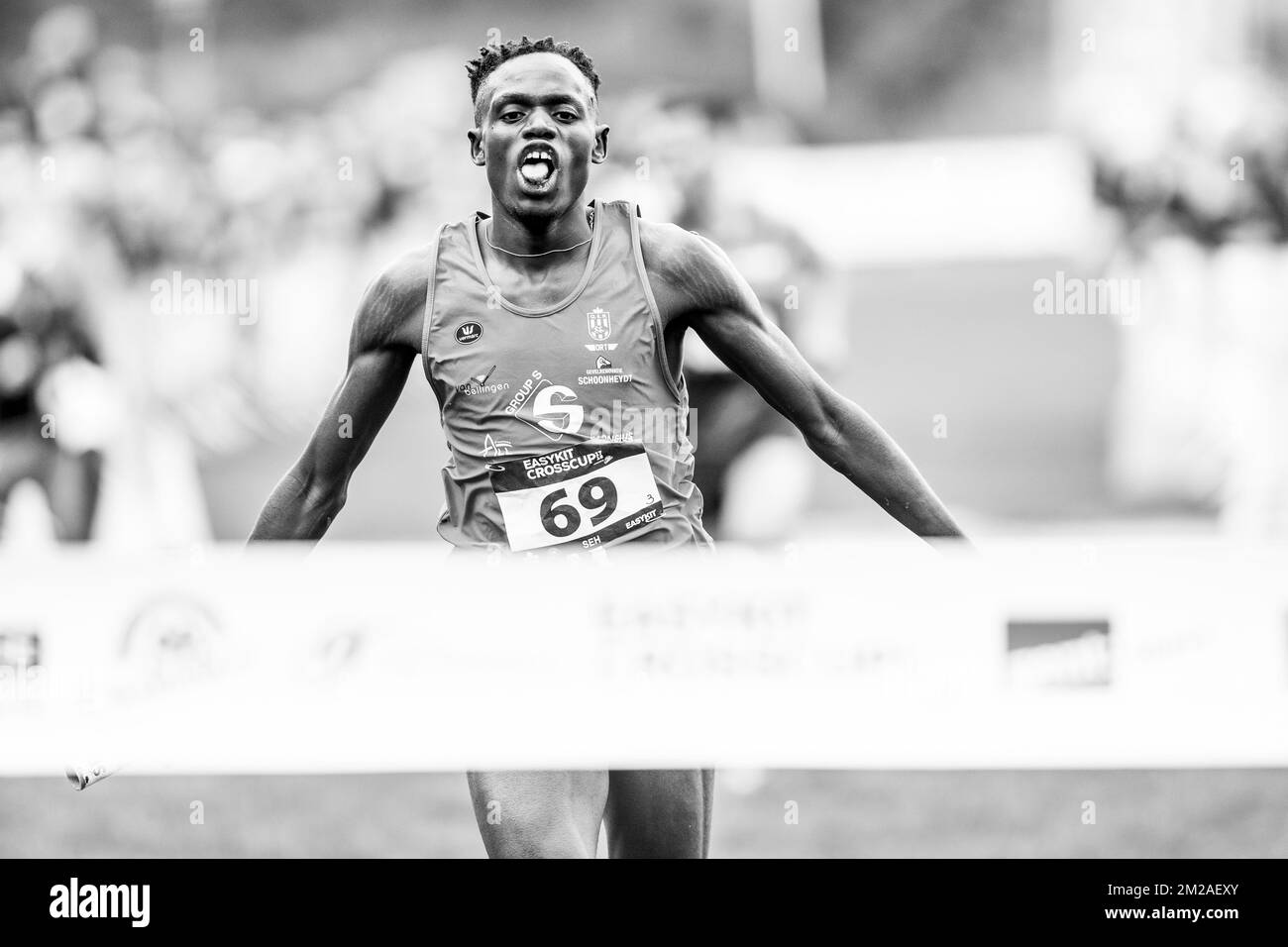 Belgian Isaac Kimeli celebrates as he crosses the finish line to win ...