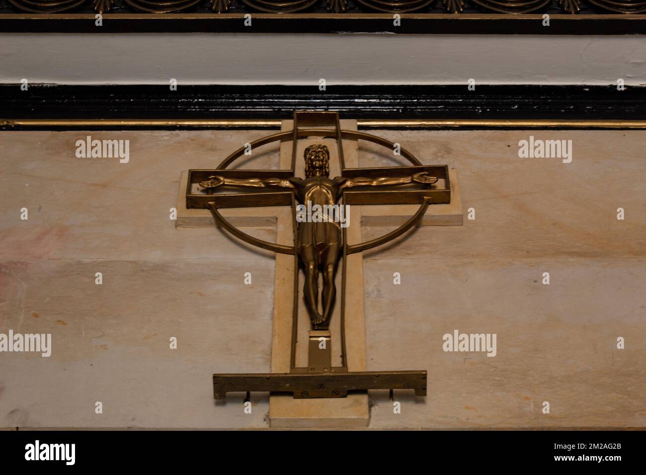 Golden crucified Jesus Christ Figure into a tombstone Stock Photo - Alamy