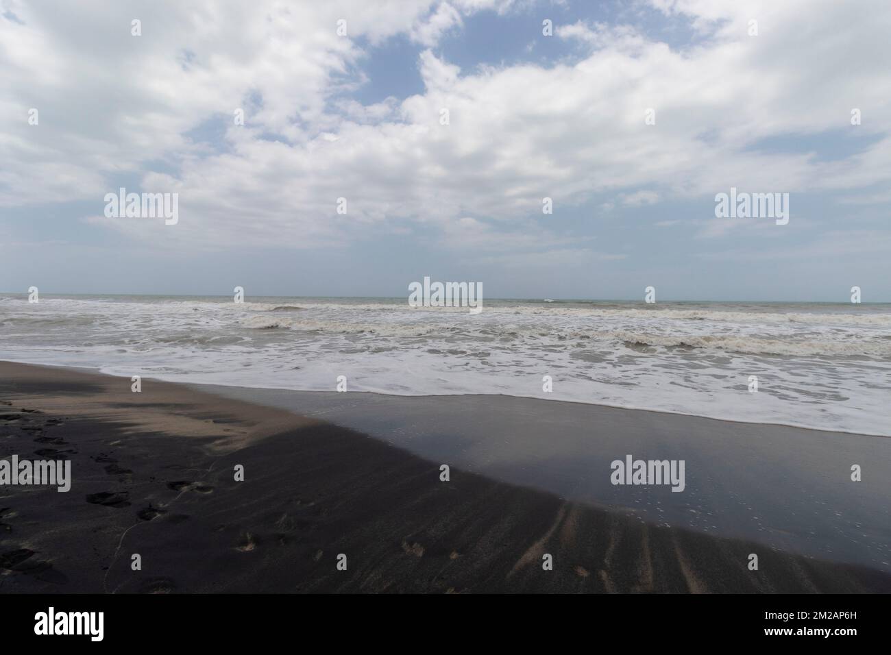 Colombian palomino beach landscape with black sand and cloudy day at ...