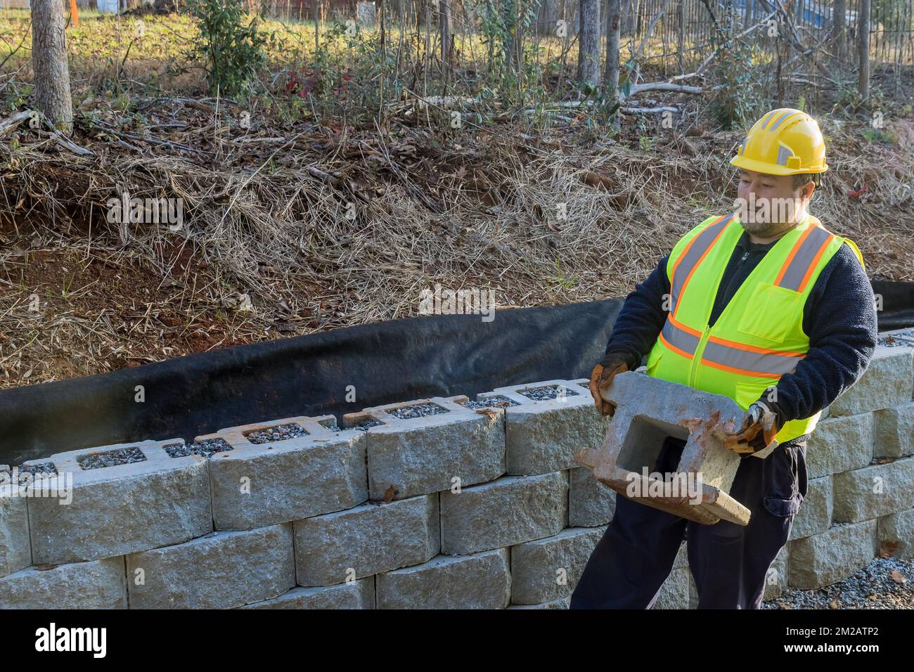 On construction site of new large block retaining wall contractor was ...