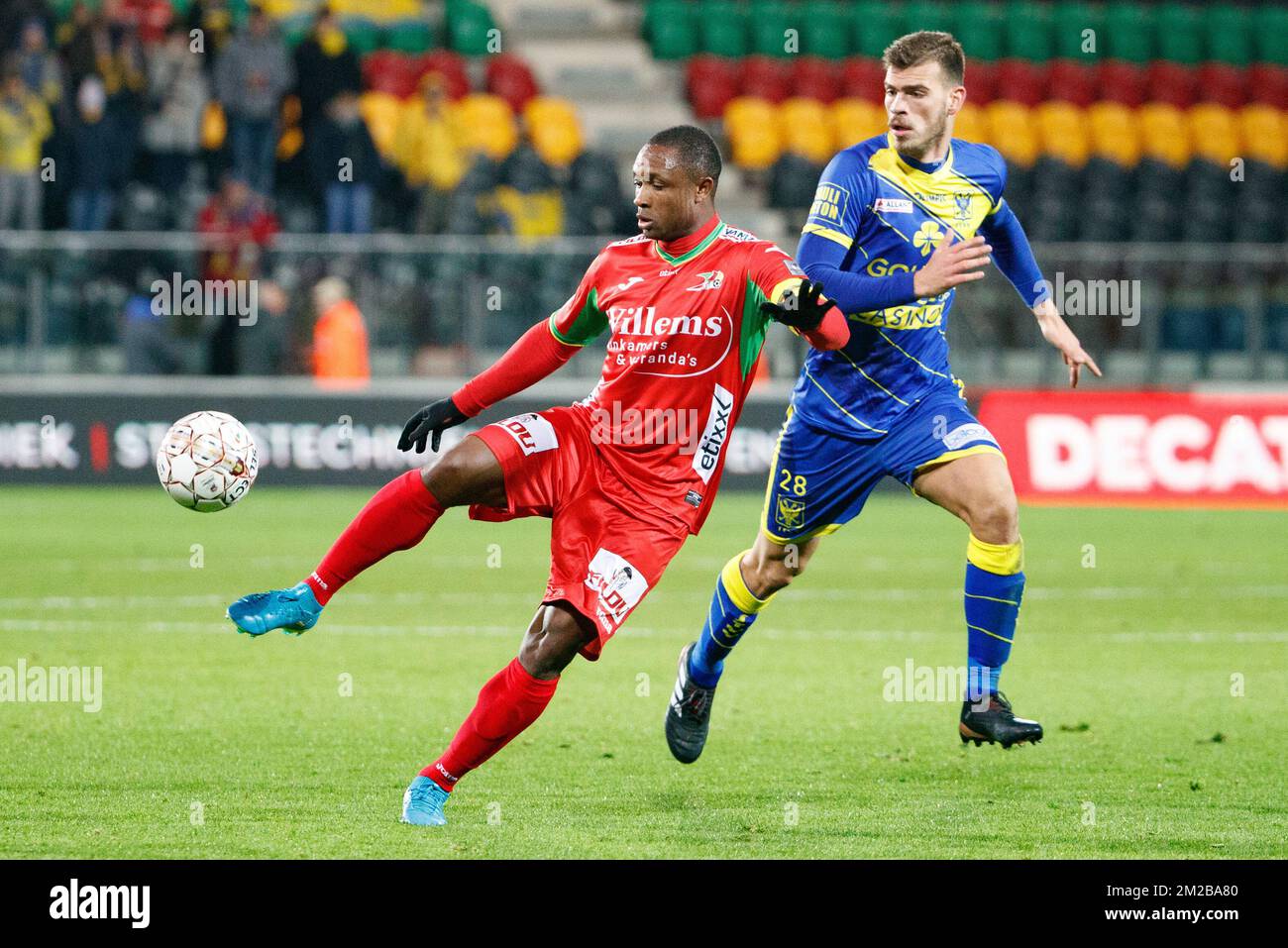 Oostende's Sebastien Siani and STVV's Dimitrios Goutas fight for the ...