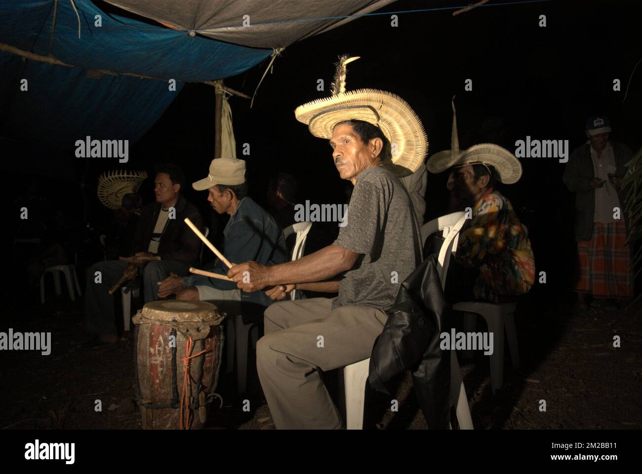 Men wearing traditional hats of Rote Island as they are playing music ...