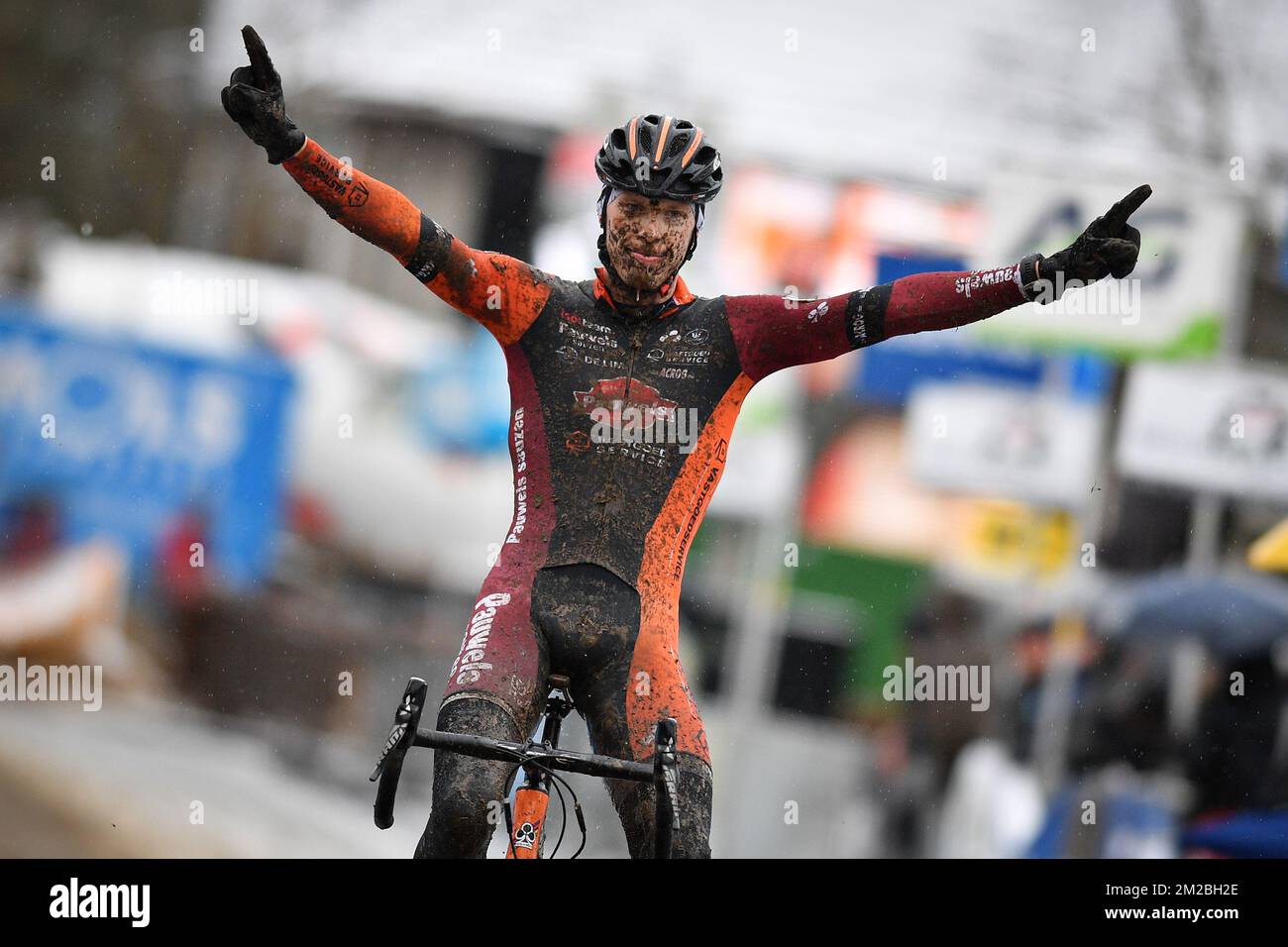 Belgian Yannick Peeters celebrates as he crosses the finish line to win ...