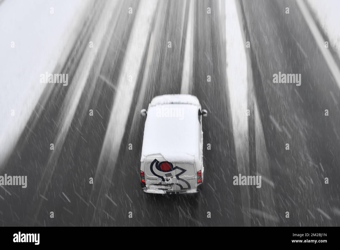 Illustration picture shows a snow-covered car on the E19 high way in ...