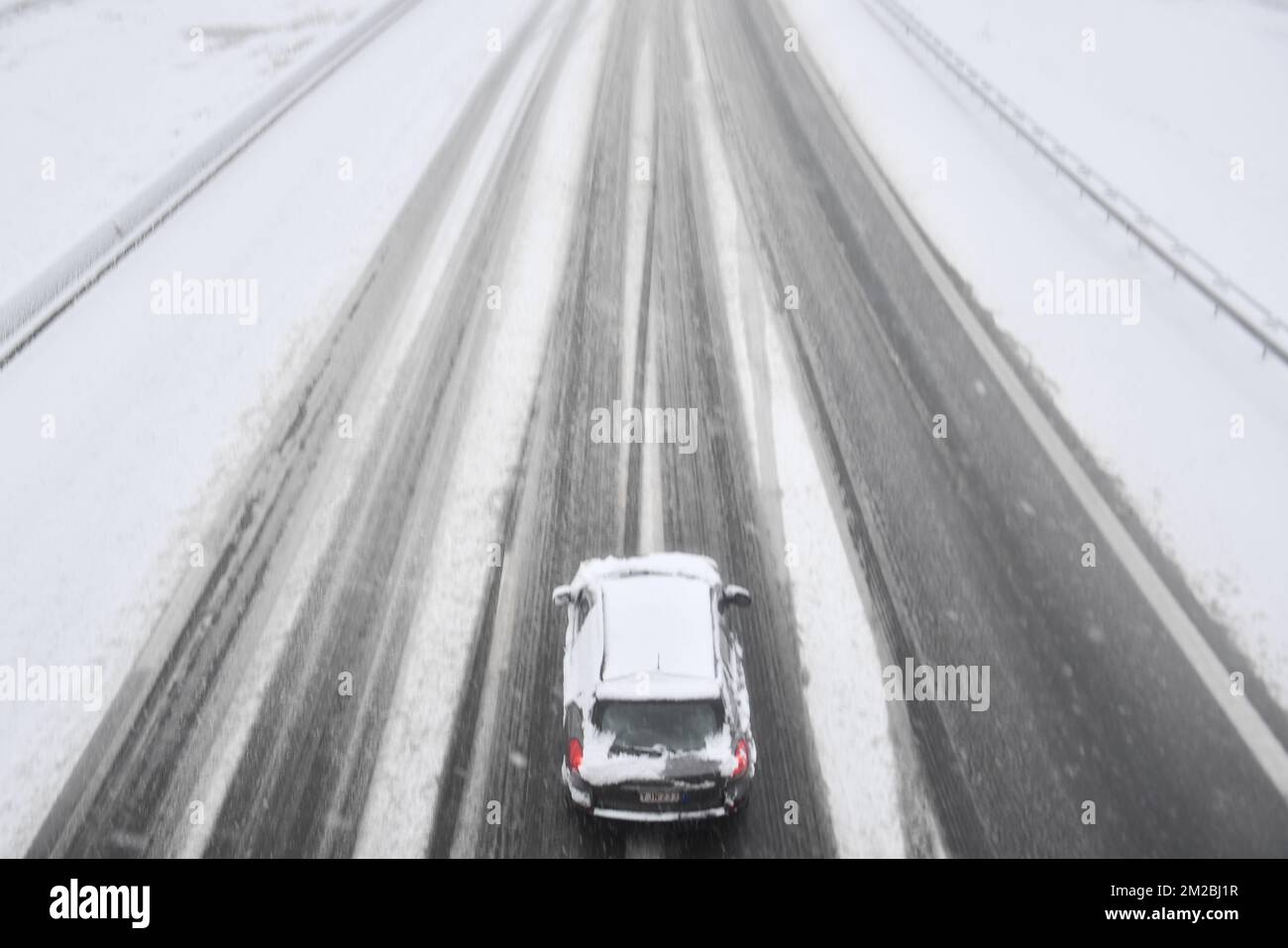 Illustration picture shows a snow-covered car on the E19 high way in ...
