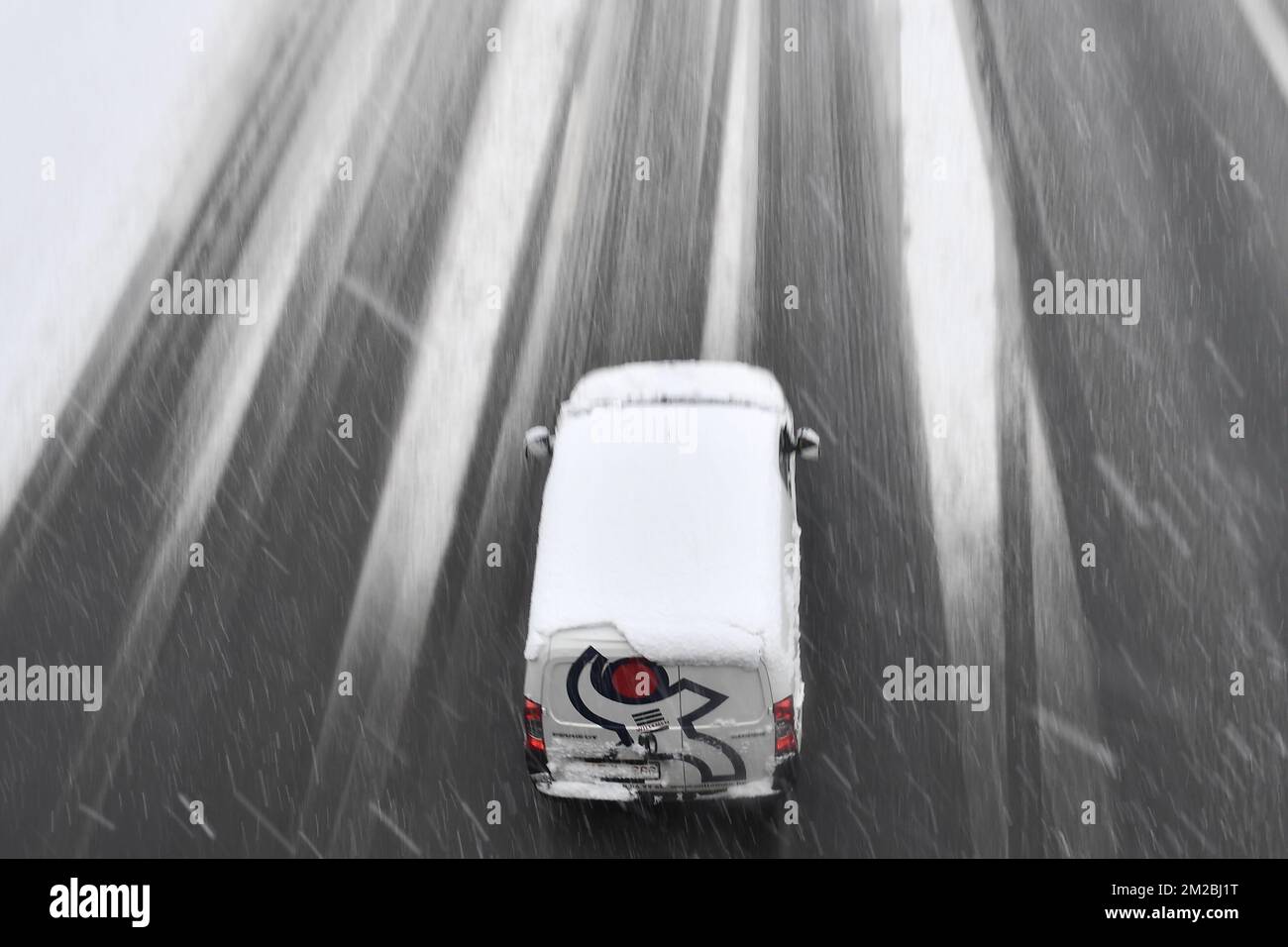 Illustration picture shows a snow-covered car on the E19 high way in ...