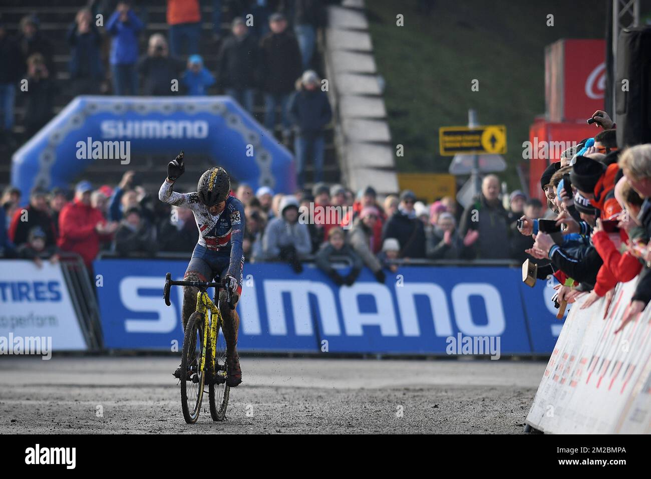 British Thomas Pidcock celebrates as he crosses the finish line to win ...
