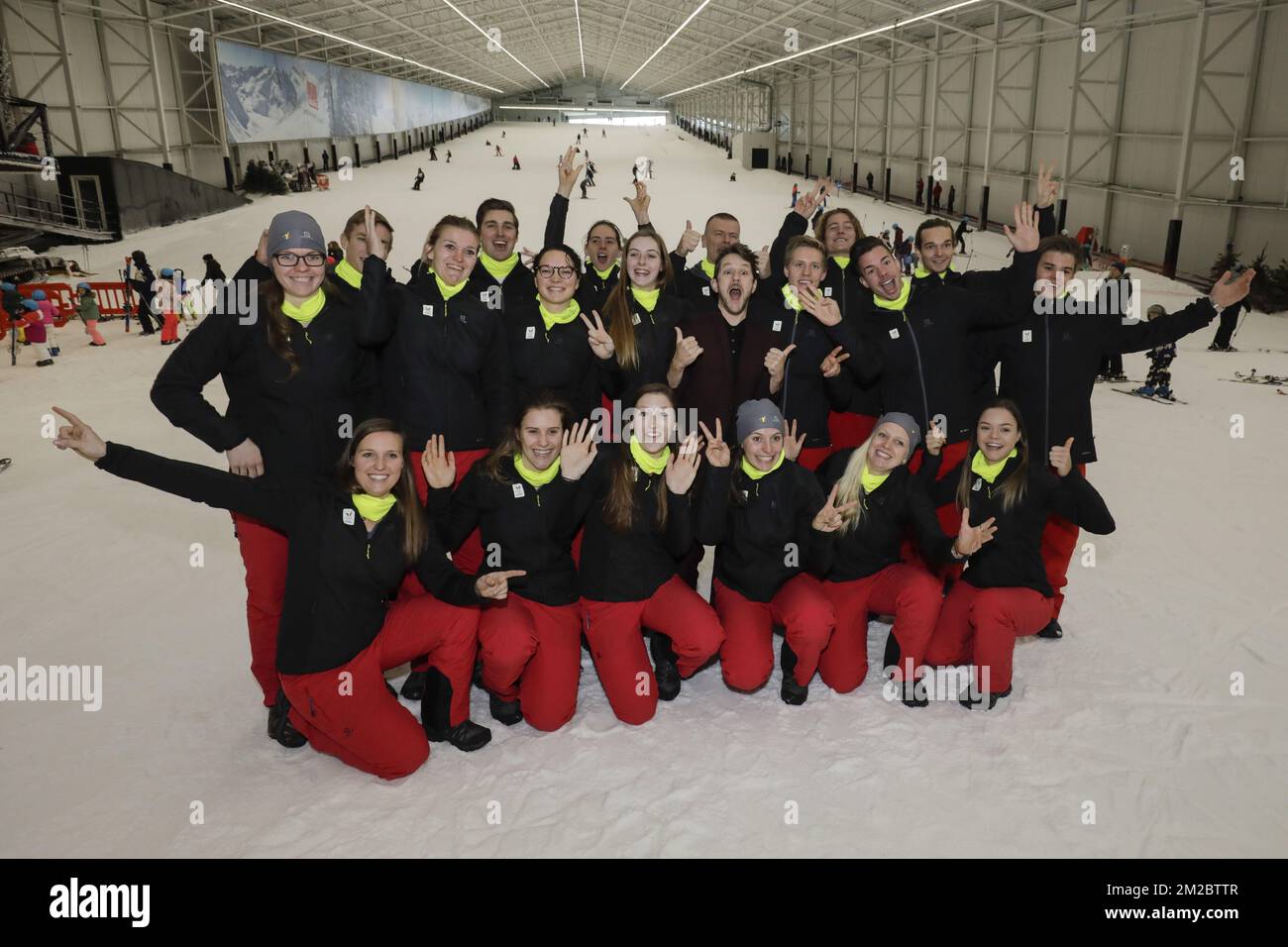 Singer Sioen poses for a group photo with the Belgian team after a ...