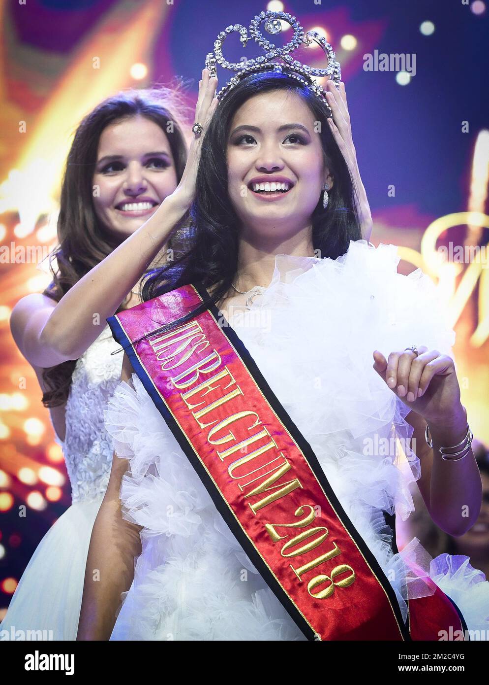 Candidate Angeline Flor Pua celebrates on the podium after winning the ...
