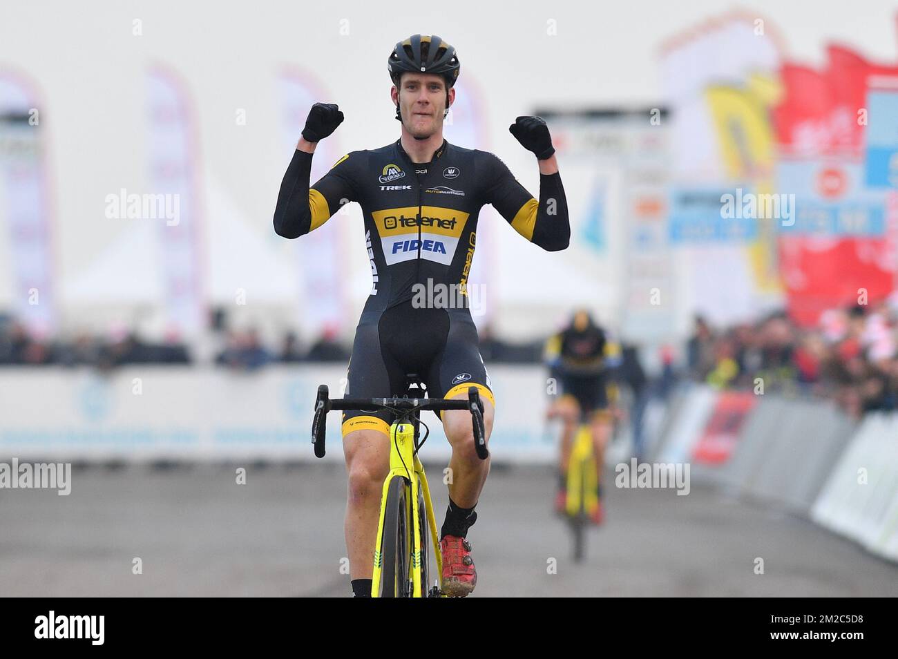 Belgian Daan Soete celebrates his third place in the men's elite race ...