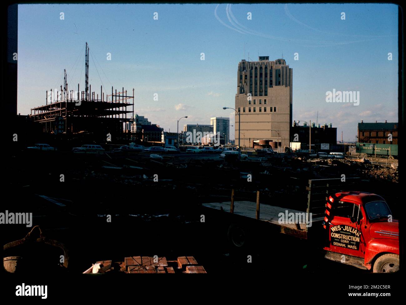 Construction area with cars and buildings in background, Boston ...