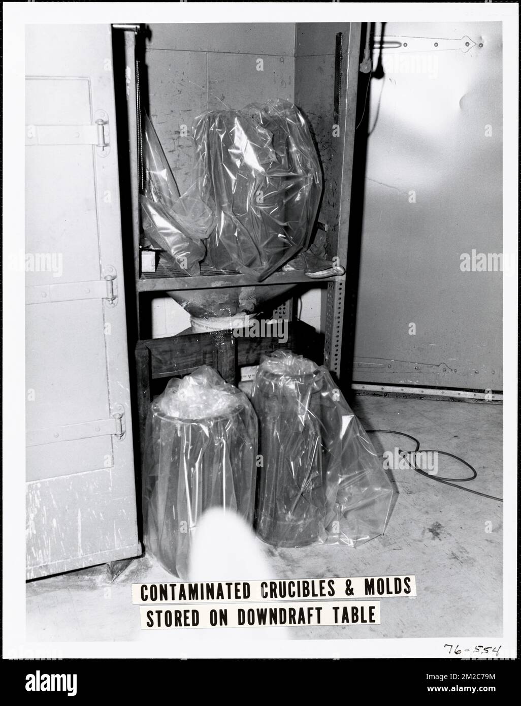 Contaminated crucibles & molds stored on downdraft table , Ordnance ...