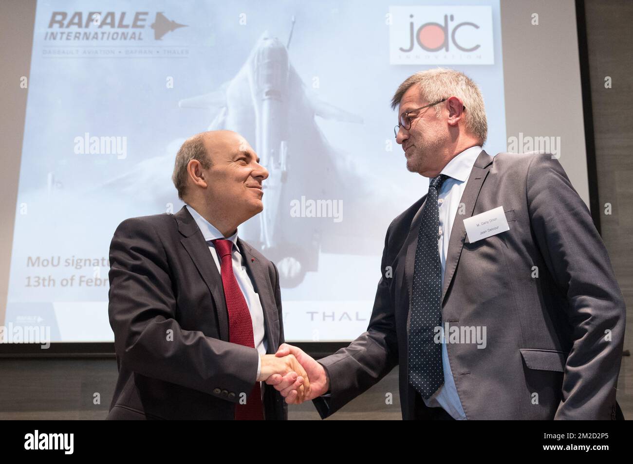Dassault Aviation CEO Eric Trappier shakes hand with JDC Innovation CEO ...