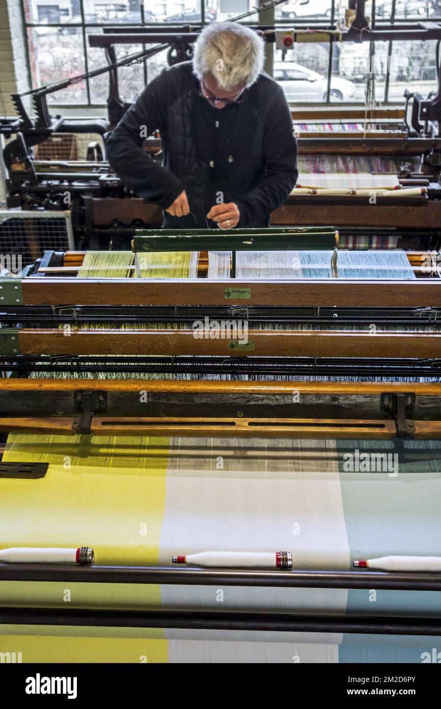 Fabric weaver operating mechanical flying shuttle loom / shuttle ...