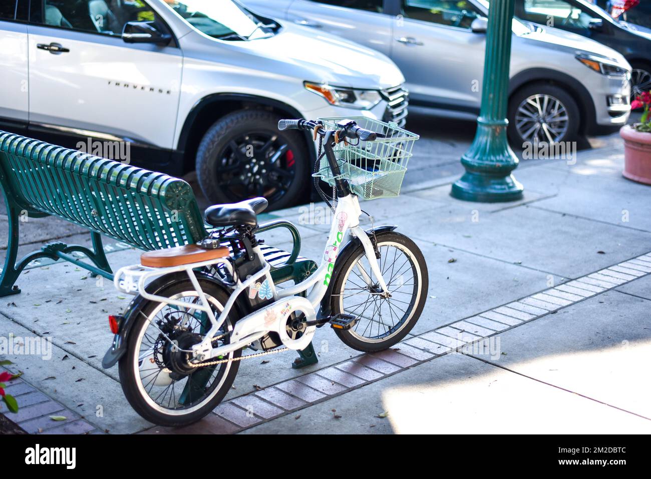 medium size white bicycle equipped with electric assist peddling Stock ...