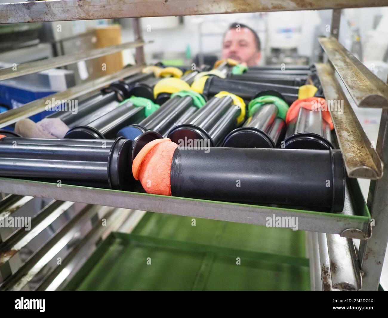 baker chef slicing red violet yellow and green star and heart shaped ...