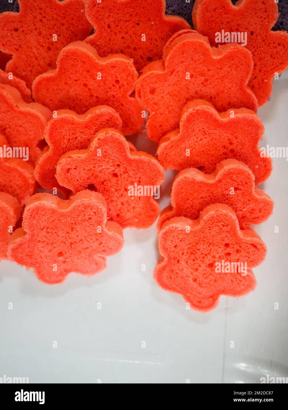 baker chef slicing red violet yellow and green star and heart shaped ...