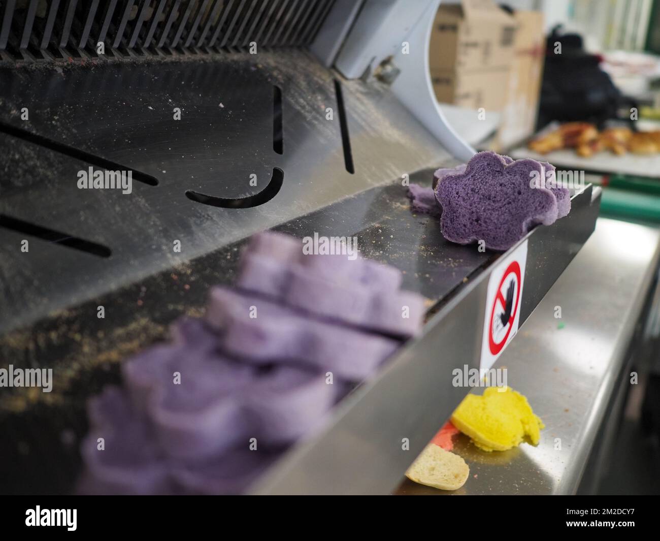 baker chef slicing red violet yellow and green star and heart shaped ...