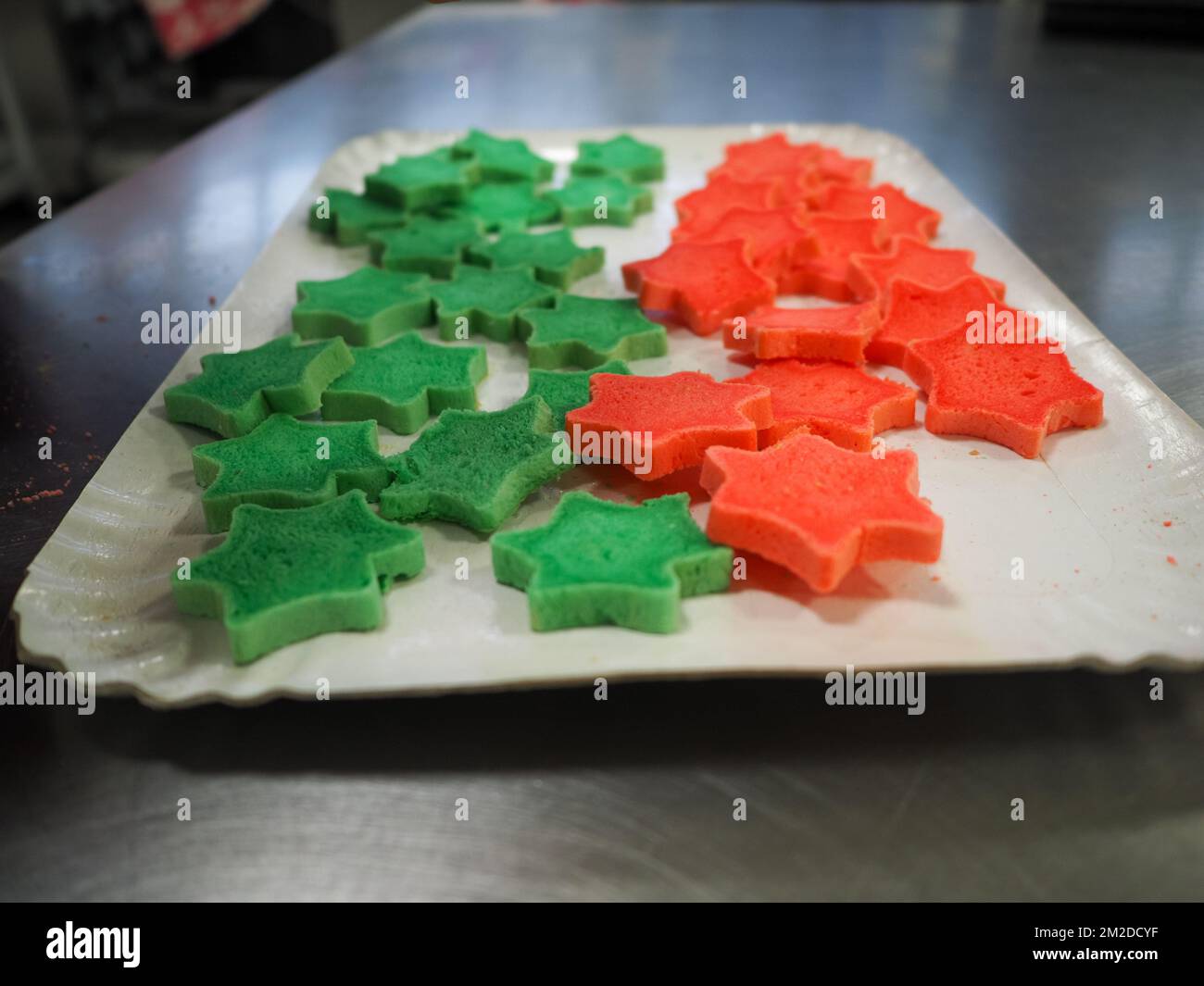 baker chef slicing red violet yellow and green star and heart shaped ...