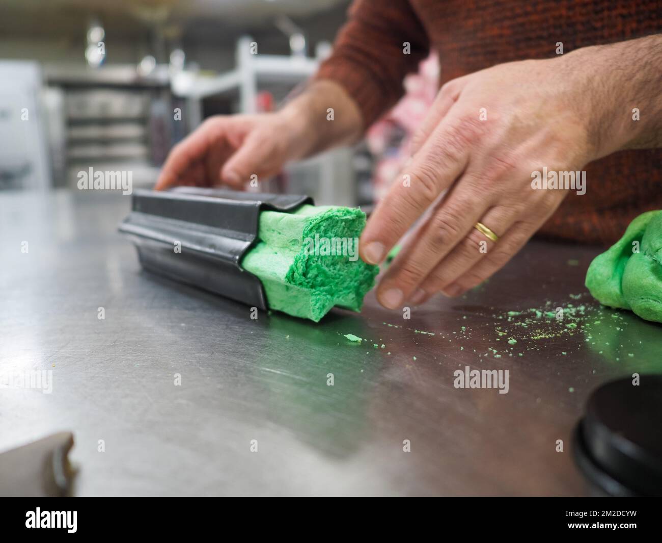 baker chef slicing red violet yellow and green star and heart shaped ...