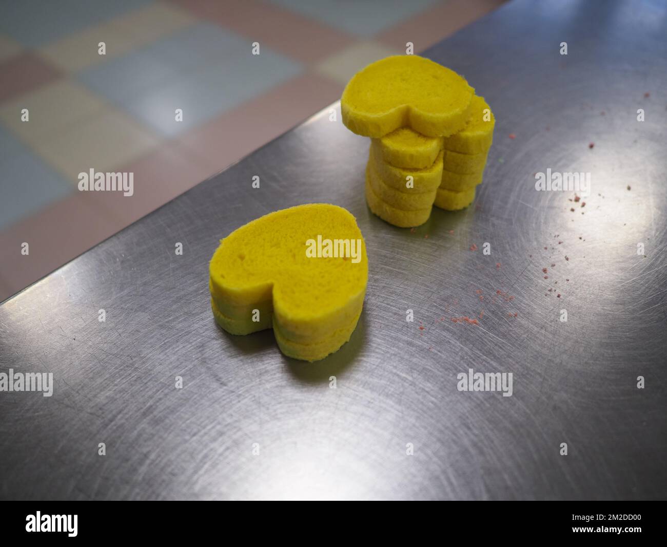 baker chef slicing red violet yellow and green star and heart shaped ...