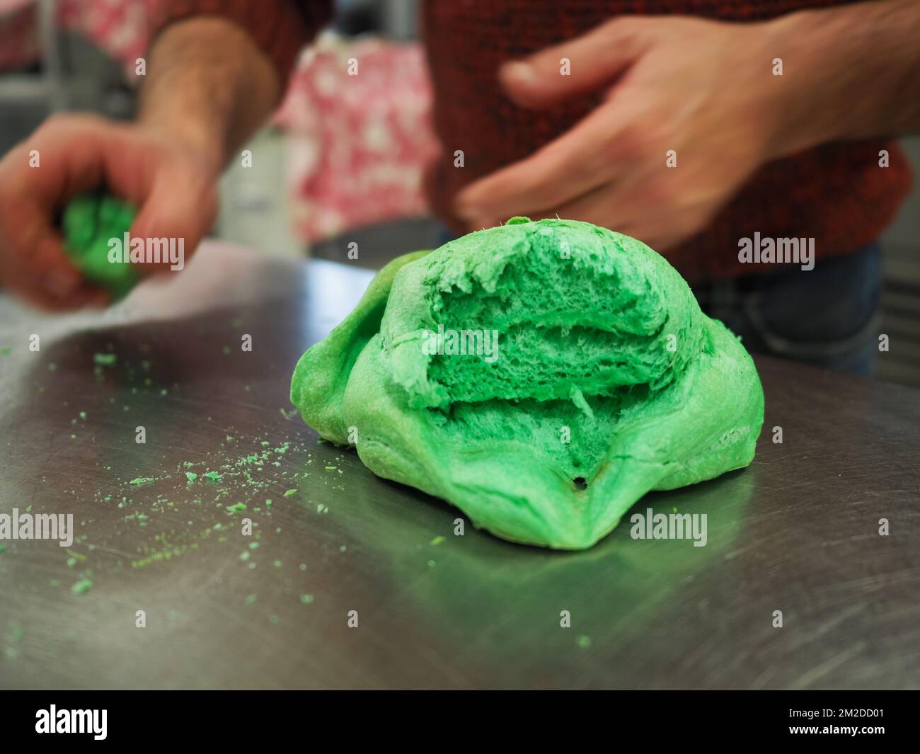 baker chef slicing red violet yellow and green star and heart shaped ...