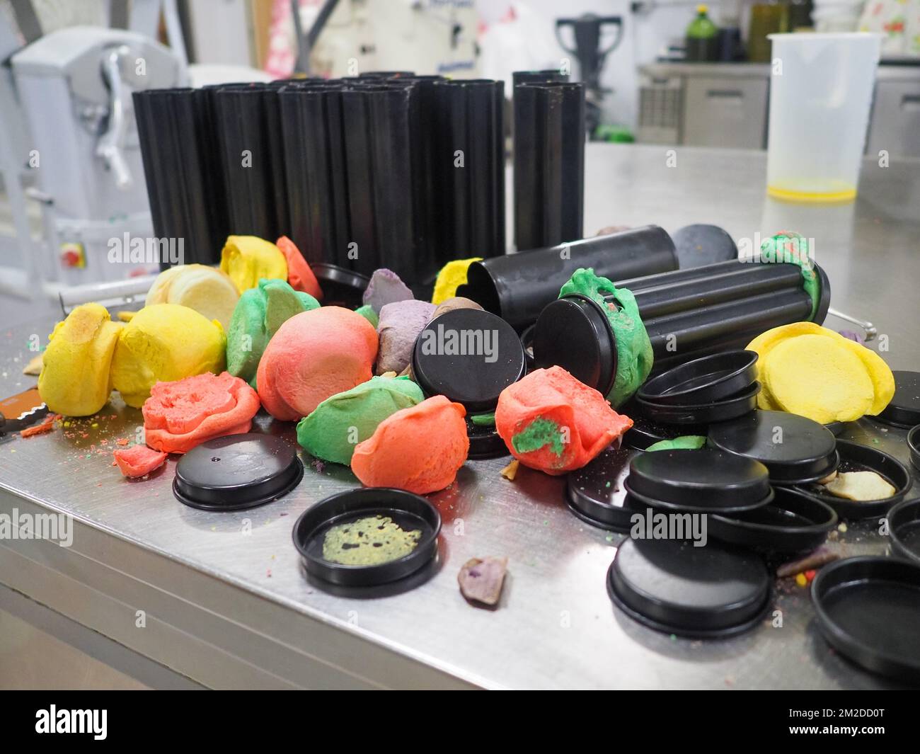 baker chef slicing red violet yellow and green star and heart shaped ...