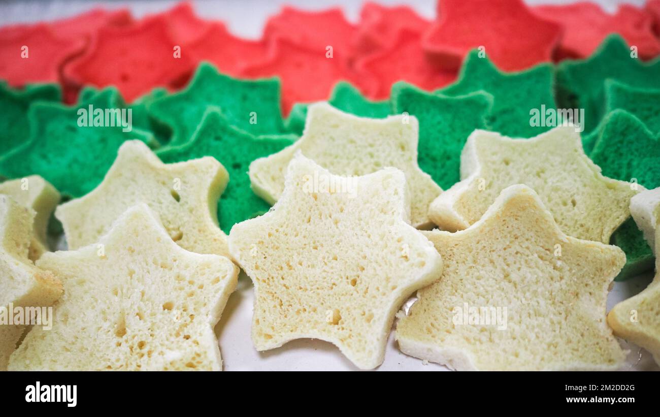 baker chef slicing red violet yellow and green star and heart shaped ...