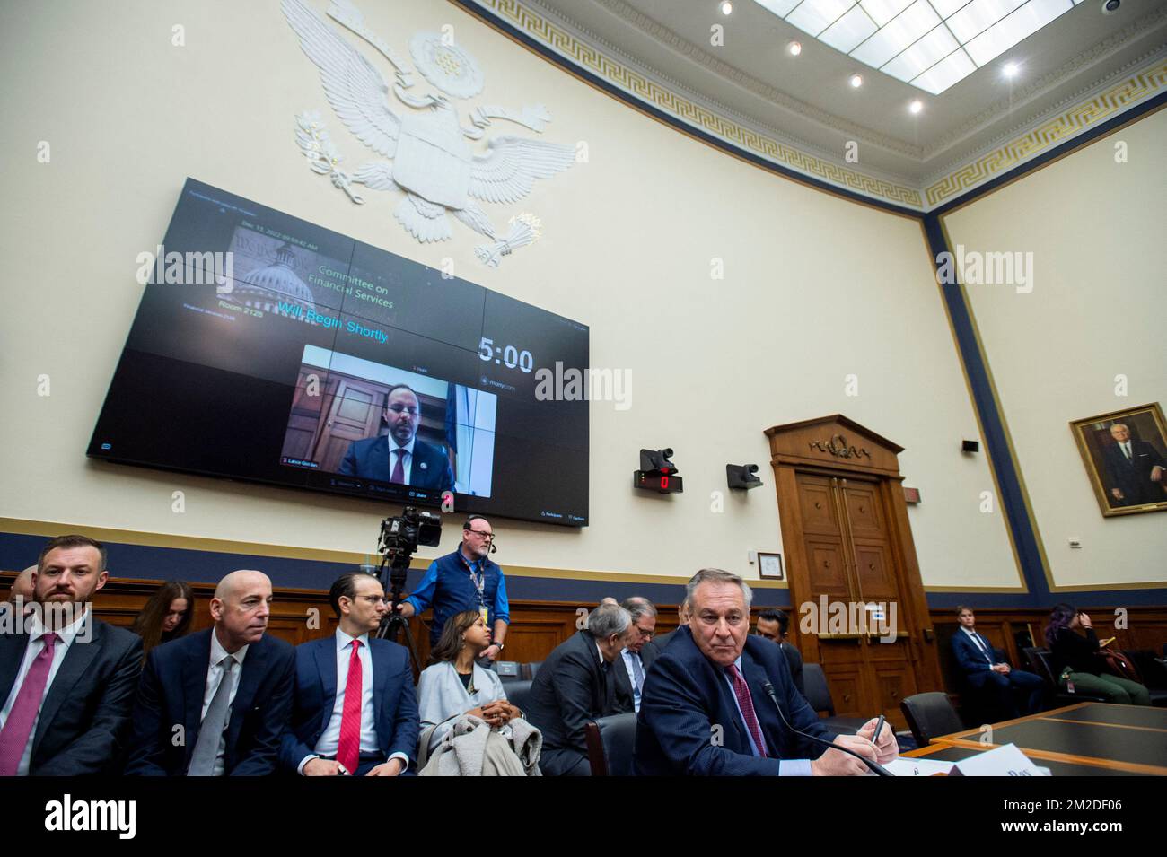 FTX Group Chief Executive Officer John J. Ray III, takes his seat at ...