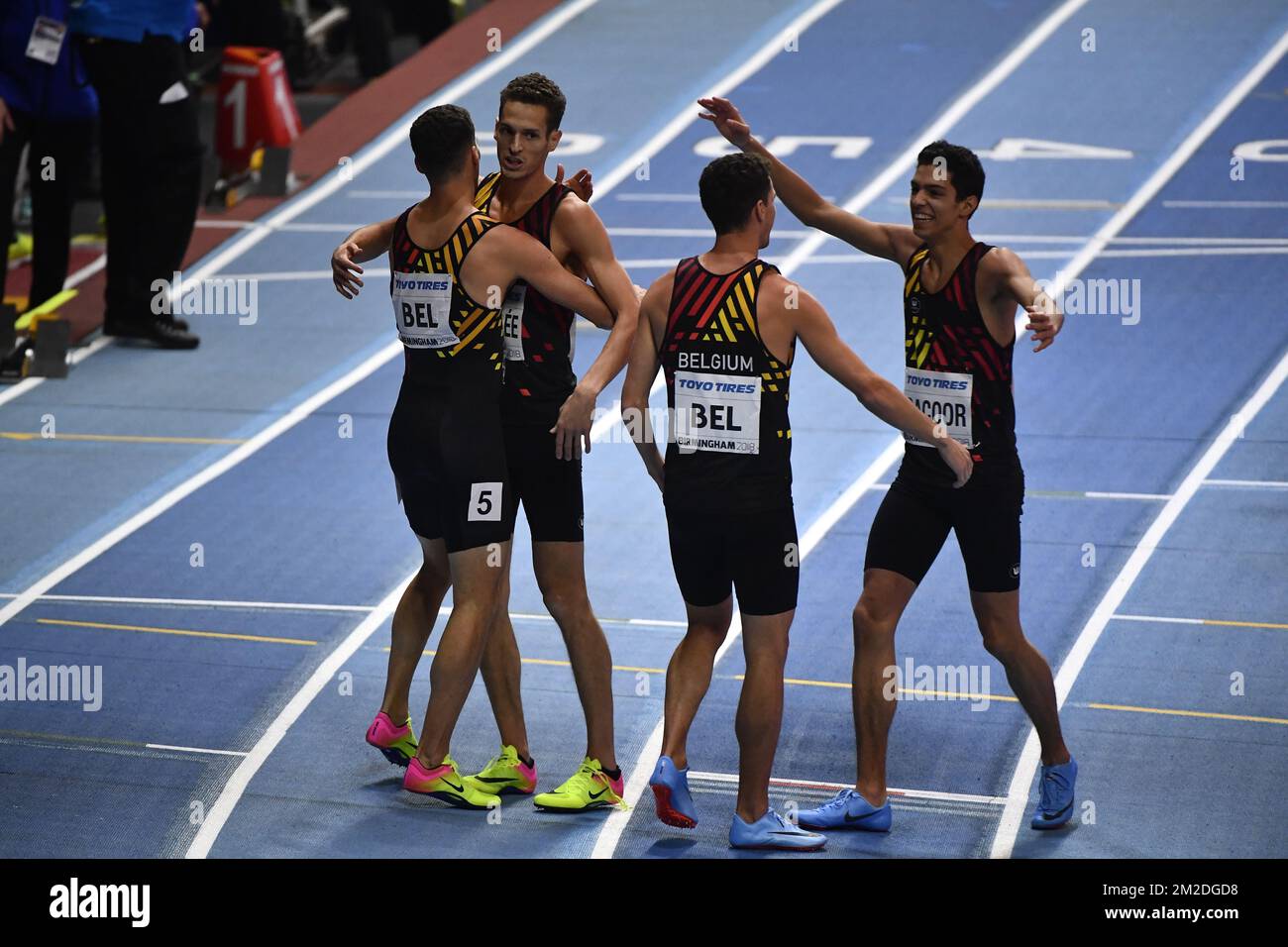 The 'Belgian Tornados' running team celebrates after finishing third ...
