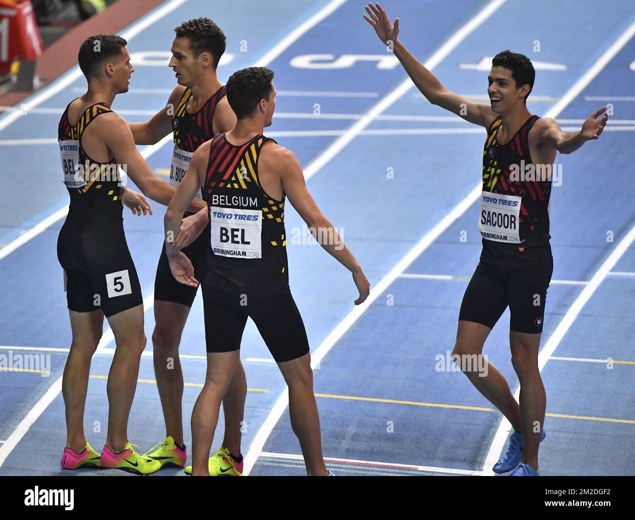 The 'Belgian Tornados' running team celebrates after finishing third ...