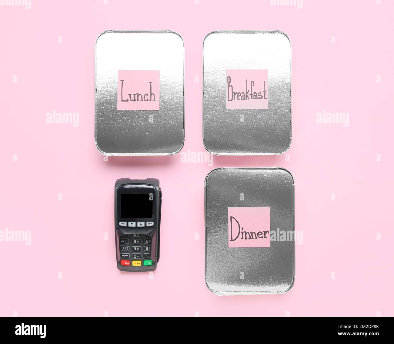 Payment terminal, takeaway boxes and sticky notes with words BREAKFAST ...