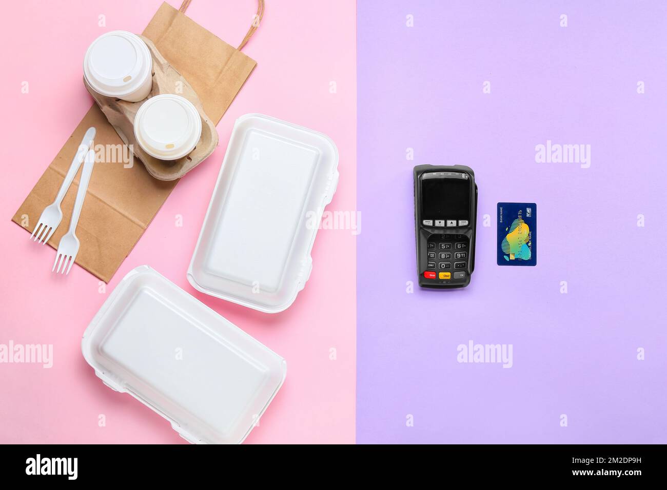 Different packages, payment terminal and credit card on color ...