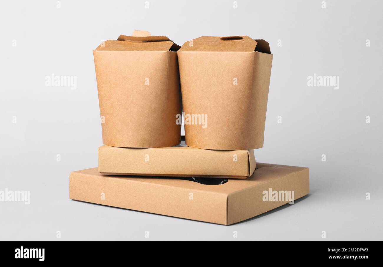 Set of different food boxes on light background Stock Photo - Alamy