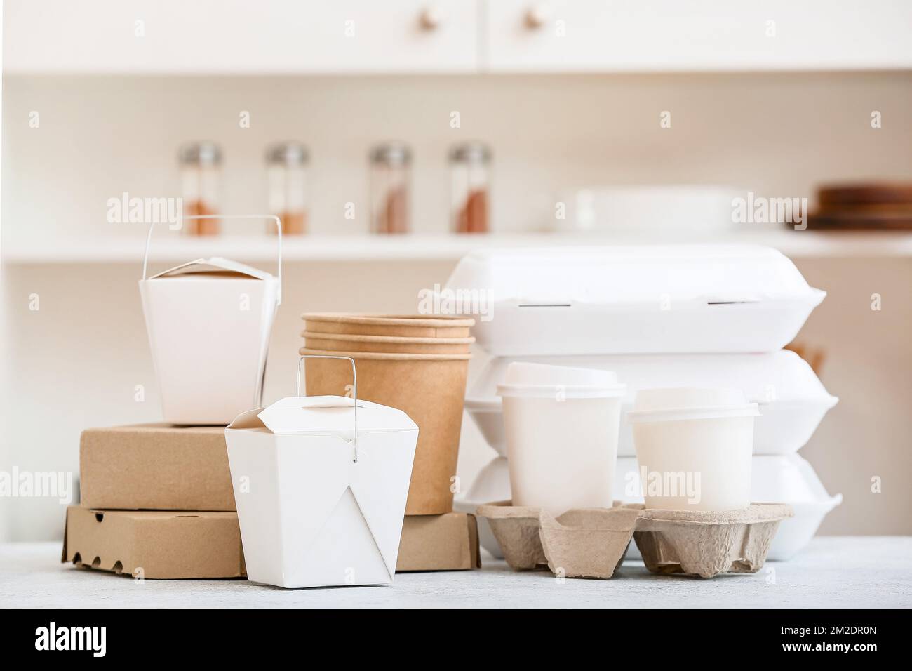 Set of food delivery containers on white table Stock Photo - Alamy