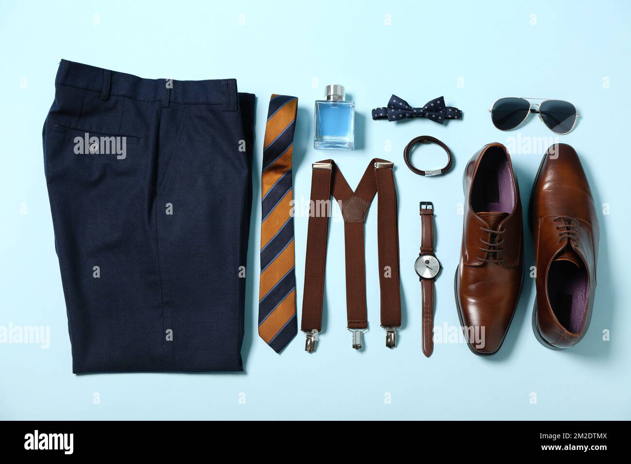 Male accessories on blue background Stock Photo - Alamy