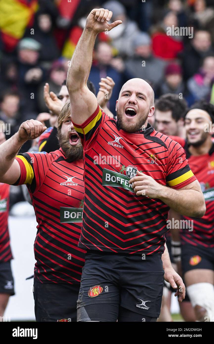Belgian players celebrate after winning the game between the Black ...