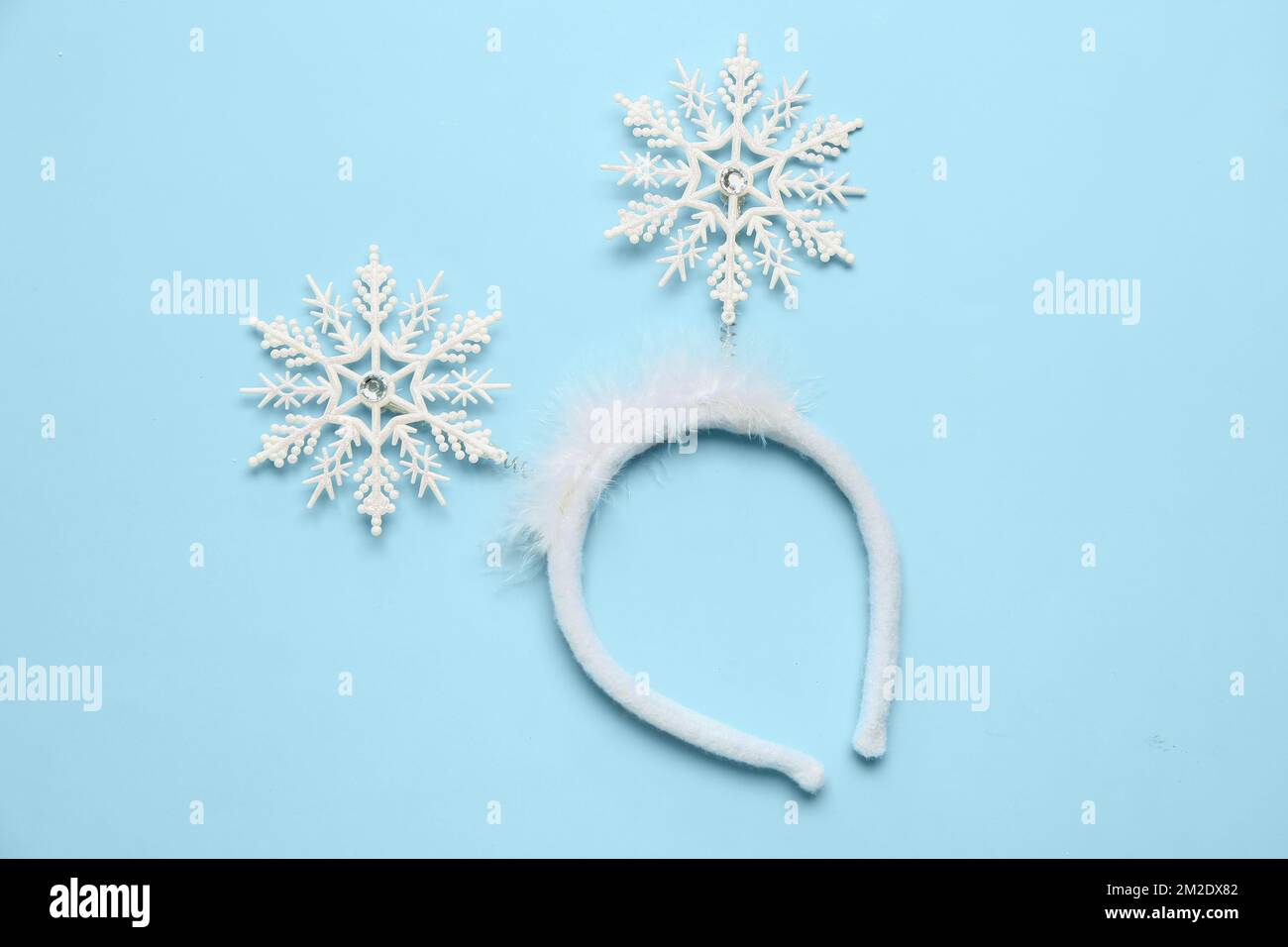 Beautiful Christmas headband on light blue background Stock Photo - Alamy