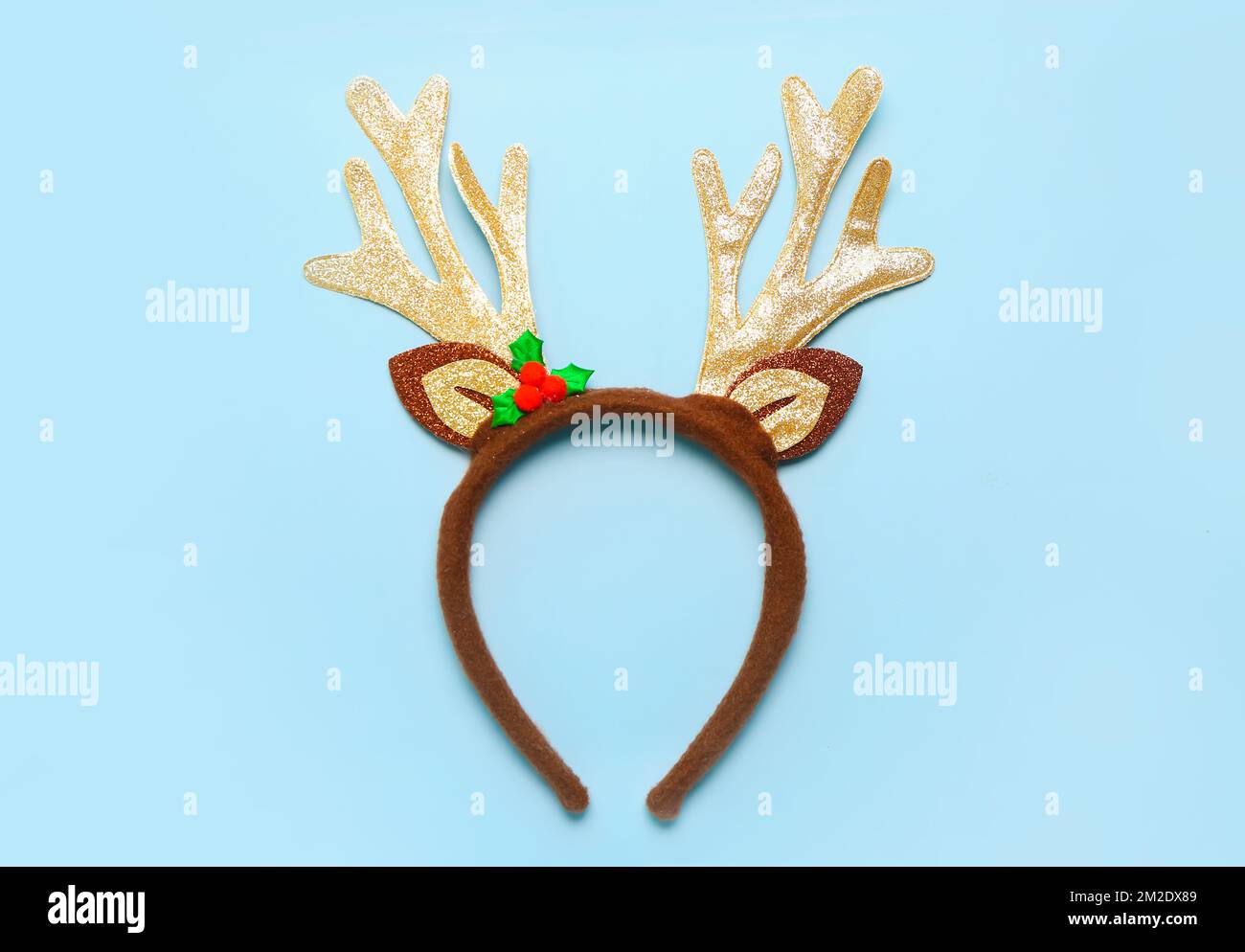 Beautiful Christmas reindeer horns on light blue background Stock Photo ...