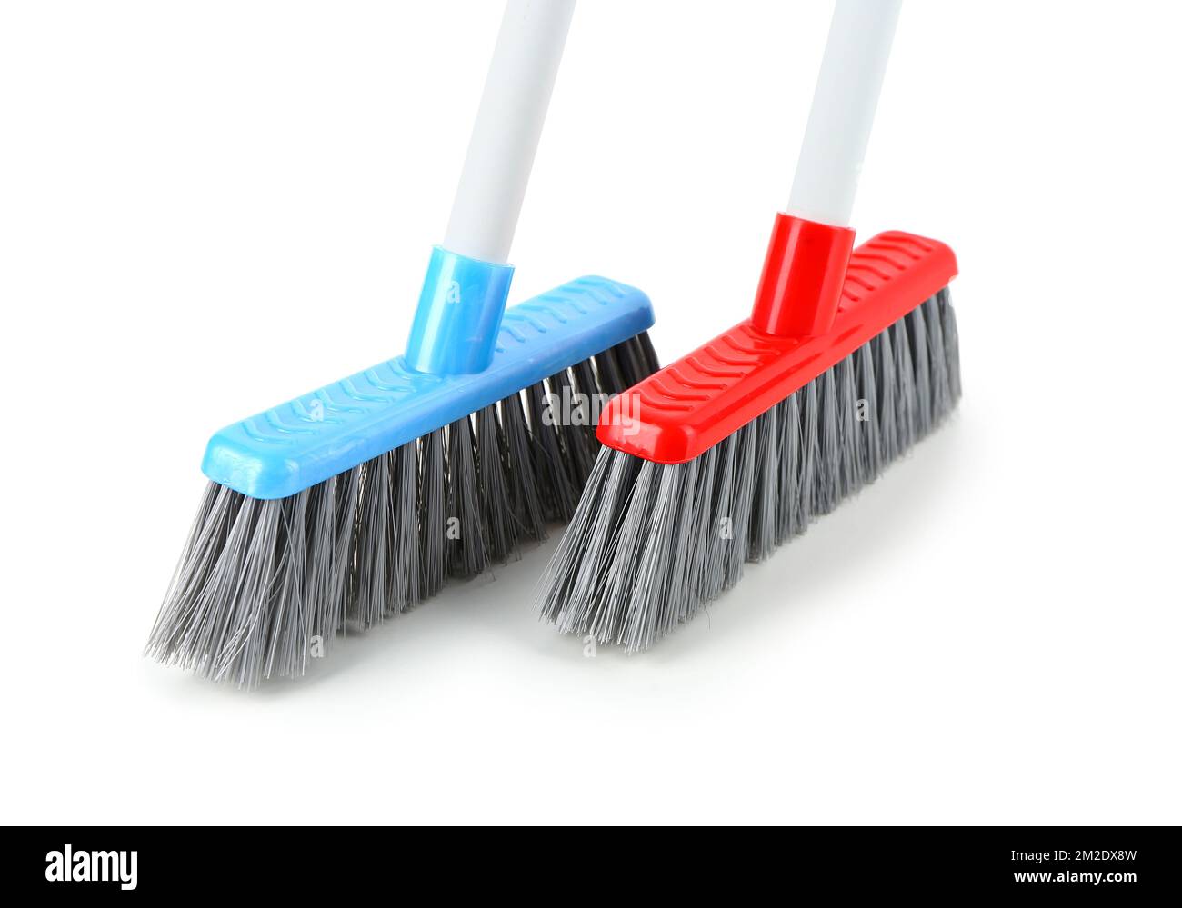 Cleaning brooms isolated on white background, closeup Stock Photo - Alamy
