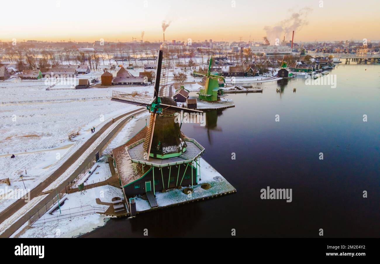 Zaanse Schans windmill village during winter with snow landscape in the ...