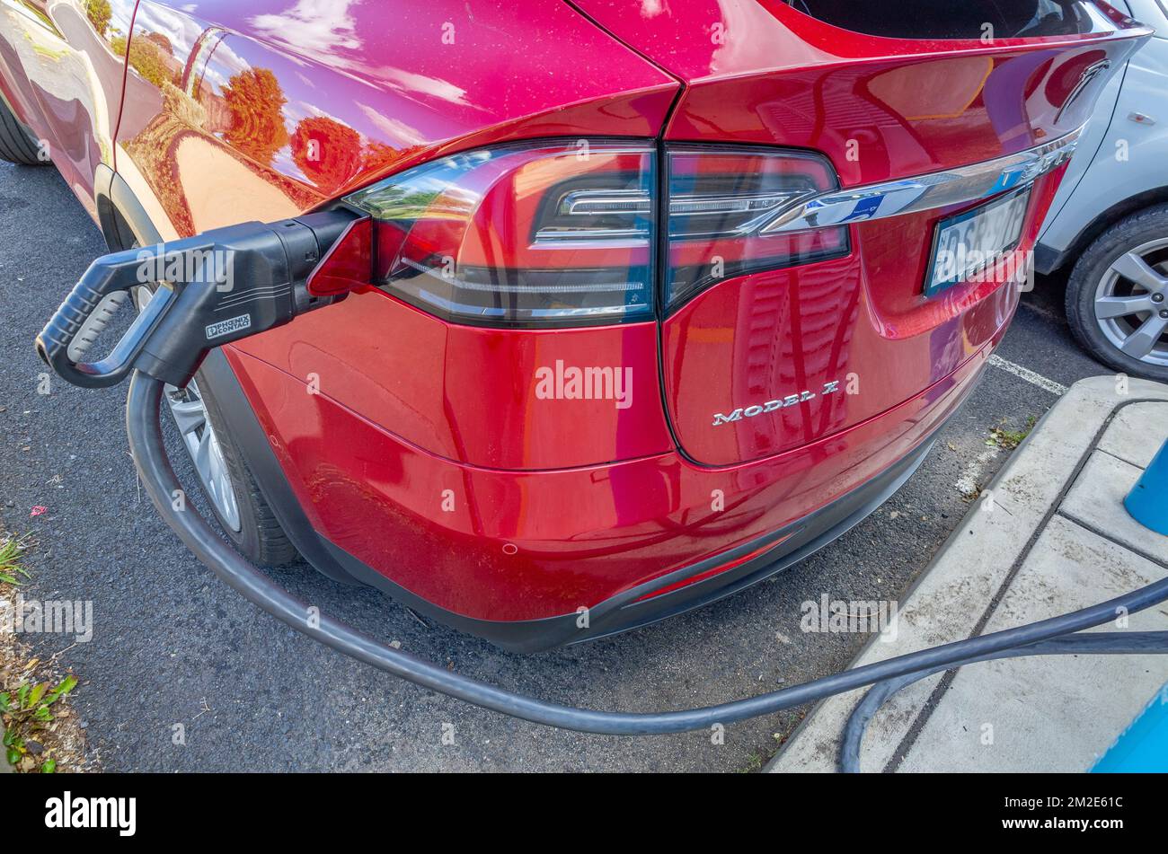 Red Tesla Electric car being charged in Glen Innes, northern new south ...