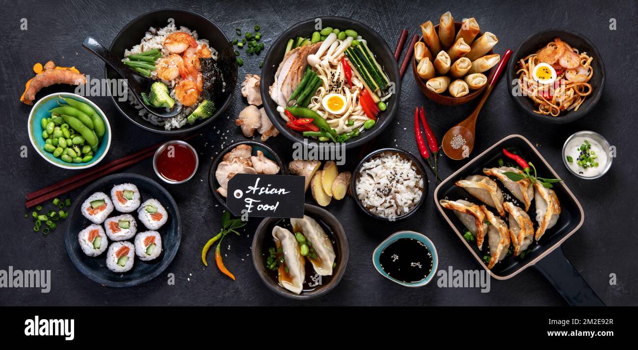 Traditional Asian food. Various of asian meals on dark background ...