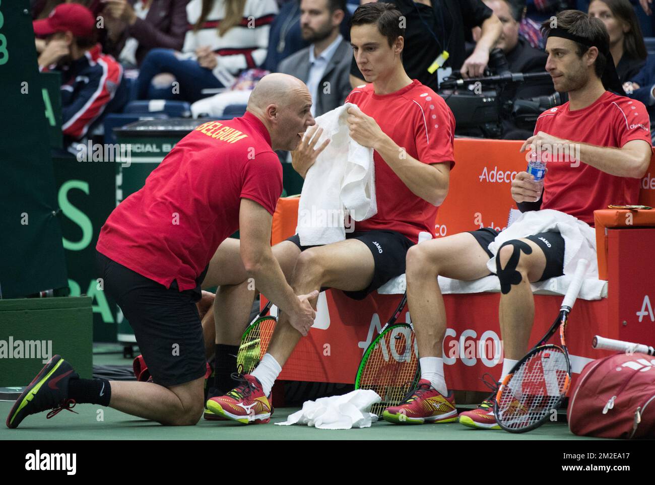 Belgian Sander Gille receives medical assistance from captain Johan Van ...