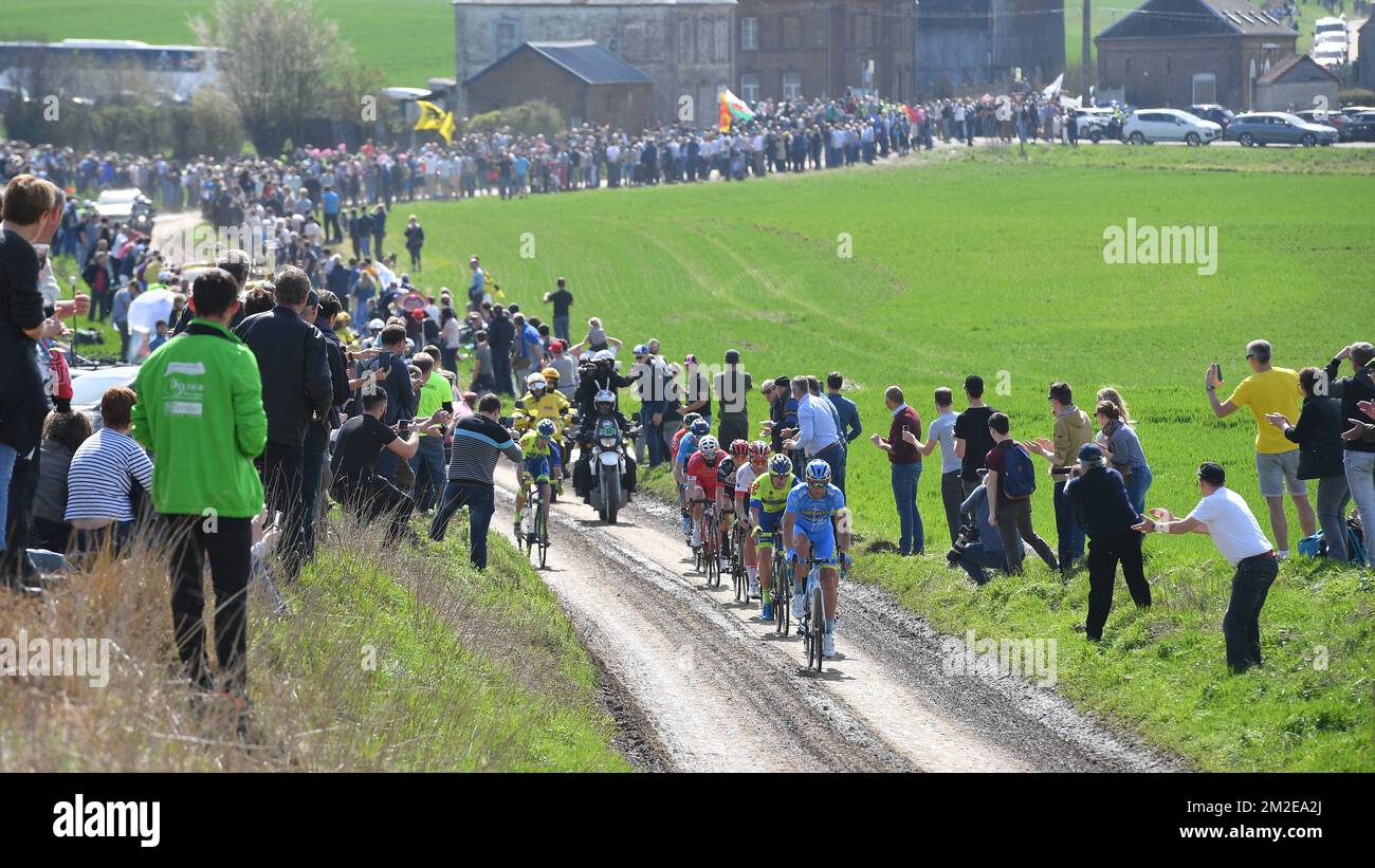 The escape group in action on the first sector with cobblestones (paves ...