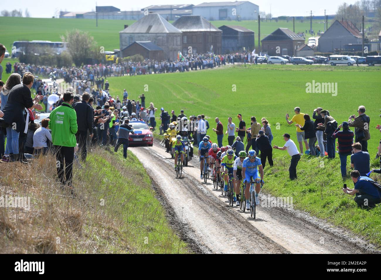 The escape group in action on the first sector with cobblestones (paves ...