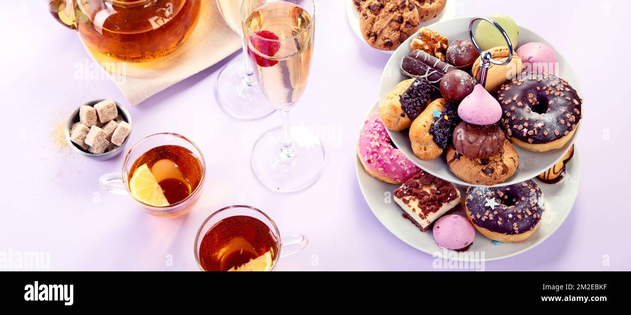 Traditional English tea. Afternoon tea with selection of sweets on ...